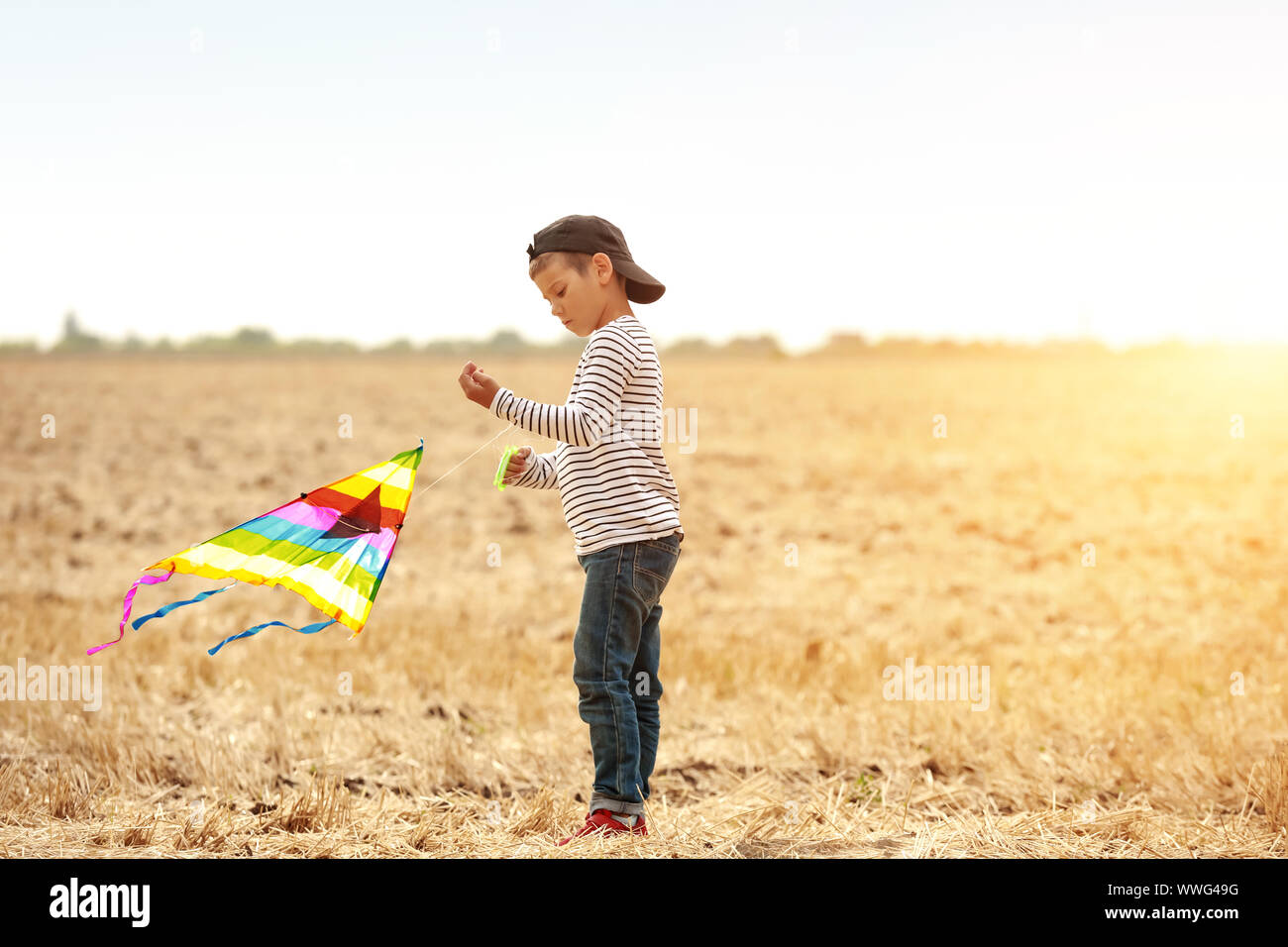 Little boy flying kite hi-res stock photography and images - Alamy