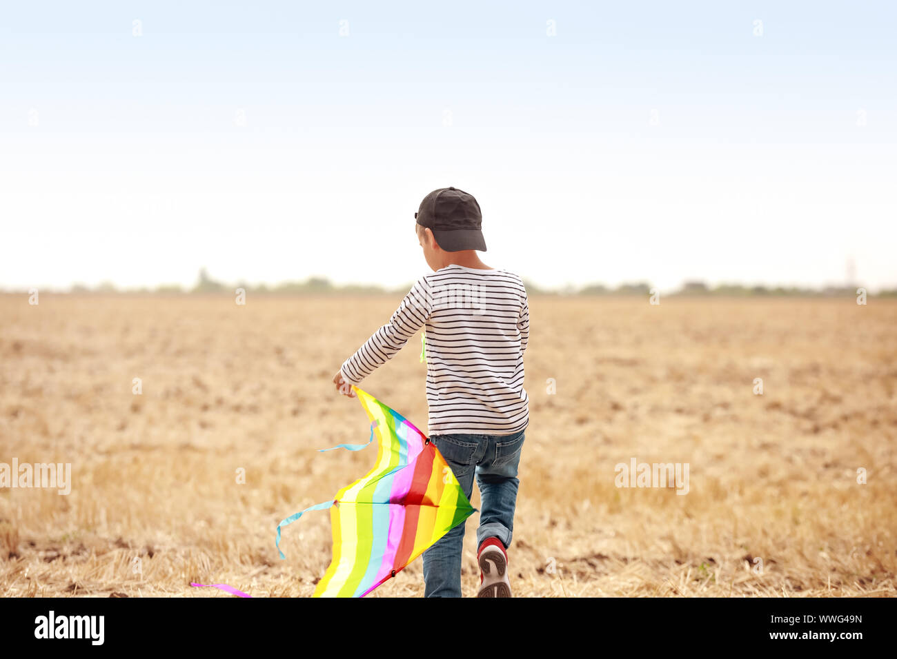 Little boy flying kite outdoors Stock Photo - Alamy
