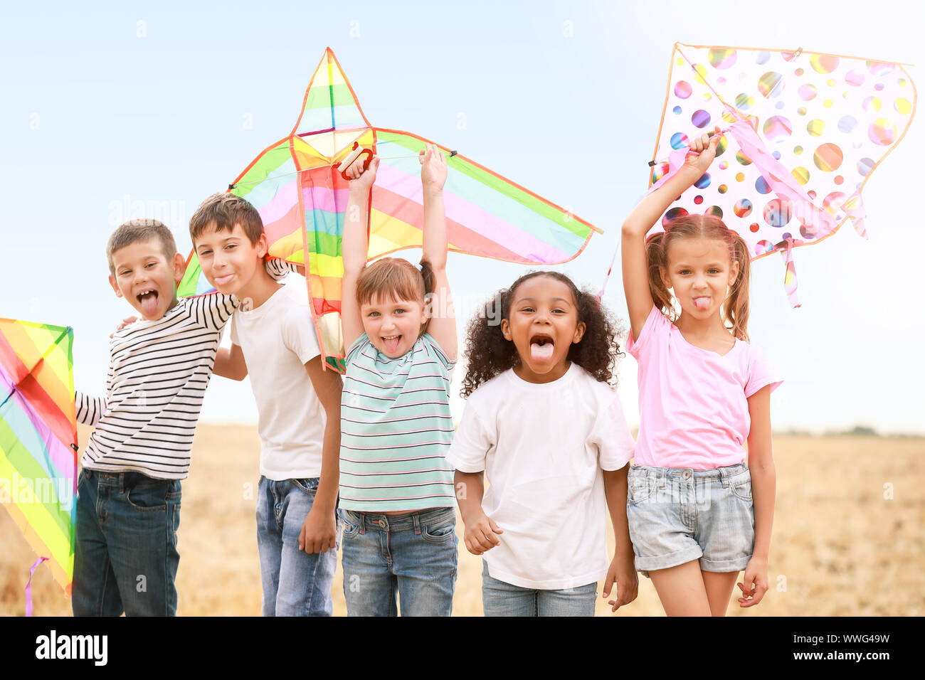 Little children flying kites outdoors Stock Photo - Alamy