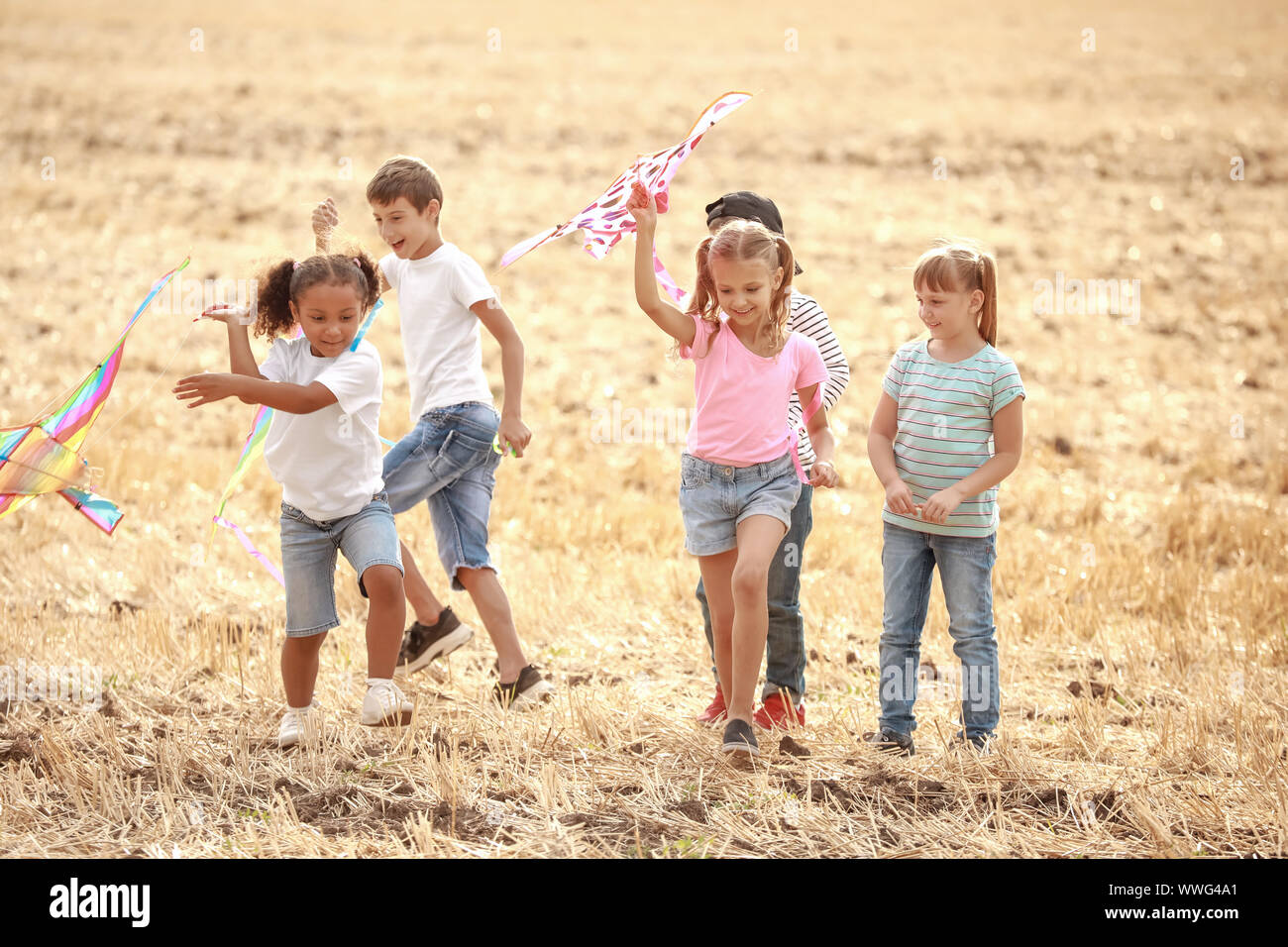 Little children flying kites outdoors Stock Photo - Alamy