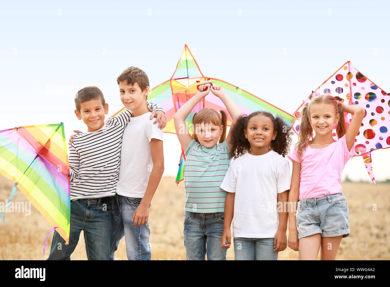 Little children flying kites outdoors Stock Photo - Alamy