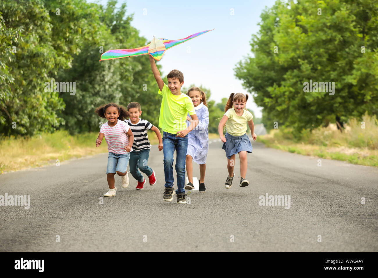 Little children flying kite outdoors Stock Photo - Alamy