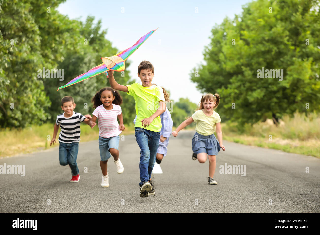 Little children flying kite outdoors Stock Photo - Alamy
