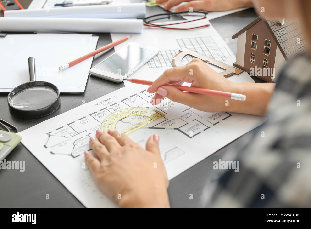Architect working on project of building in office Stock Photo - Alamy