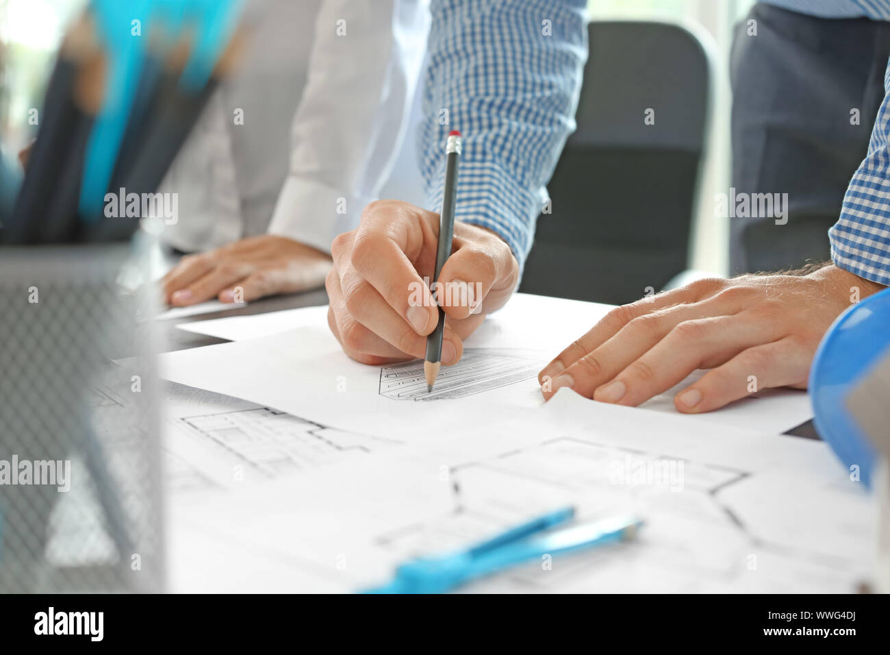 Architect working on project of building in office Stock Photo - Alamy
