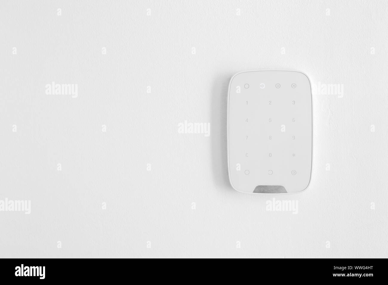 Panel of modern security system on wall indoors Stock Photo - Alamy