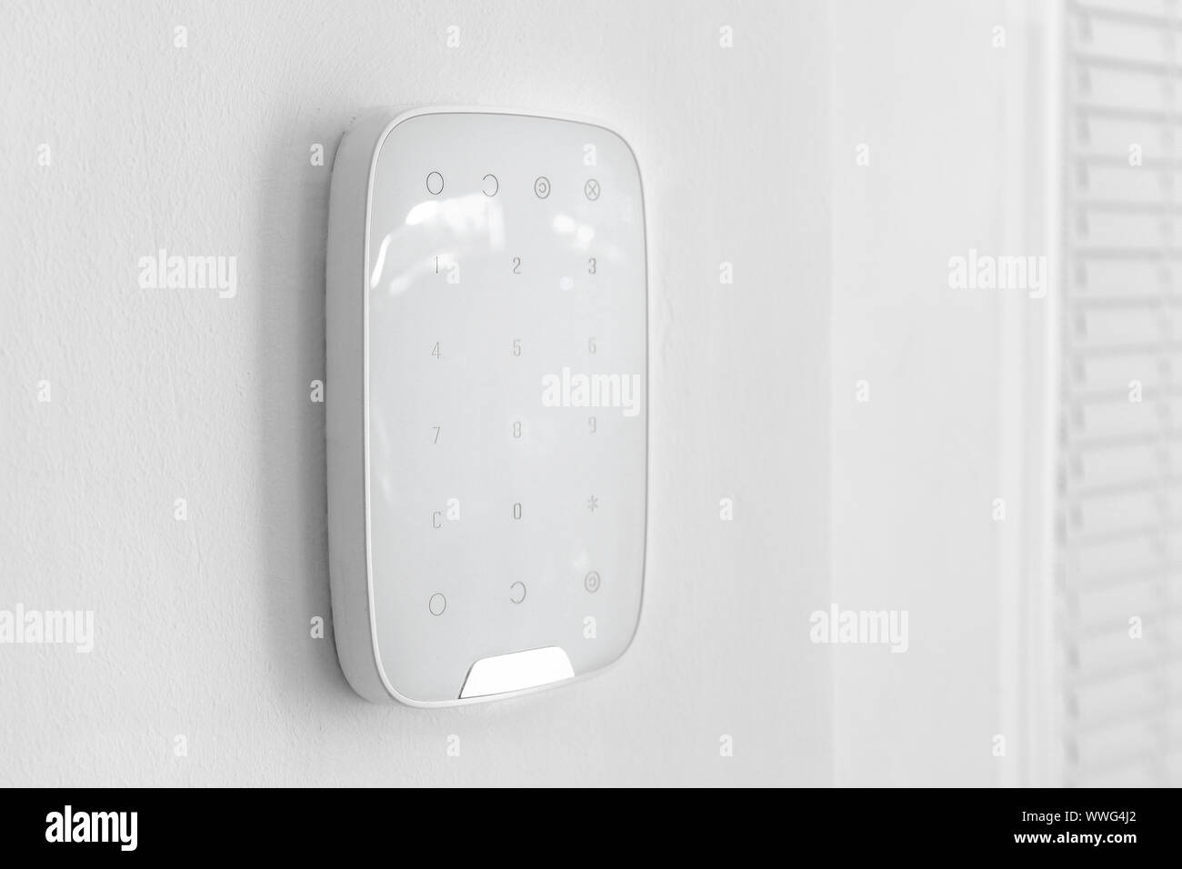 Panel of modern security system on wall indoors Stock Photo - Alamy