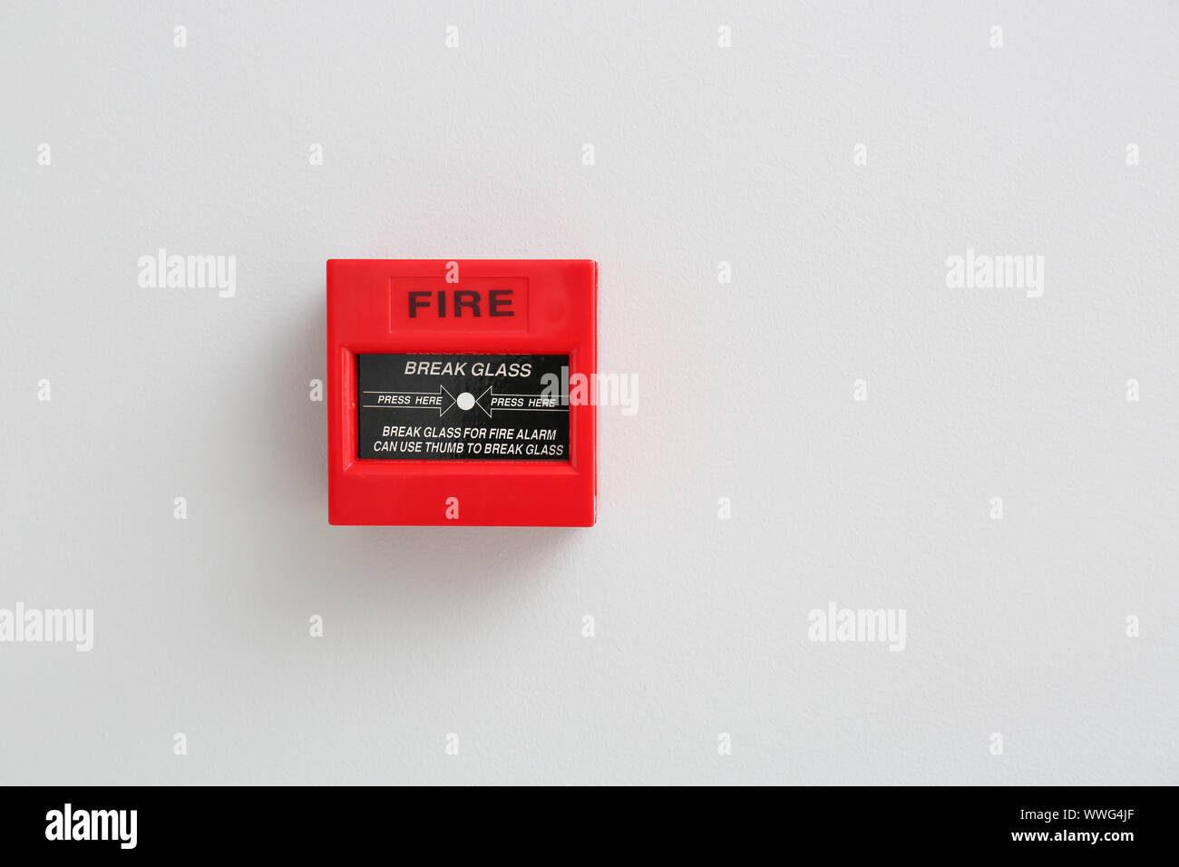 Modern manual call point of fire alarm system on light wall Stock Photo ...