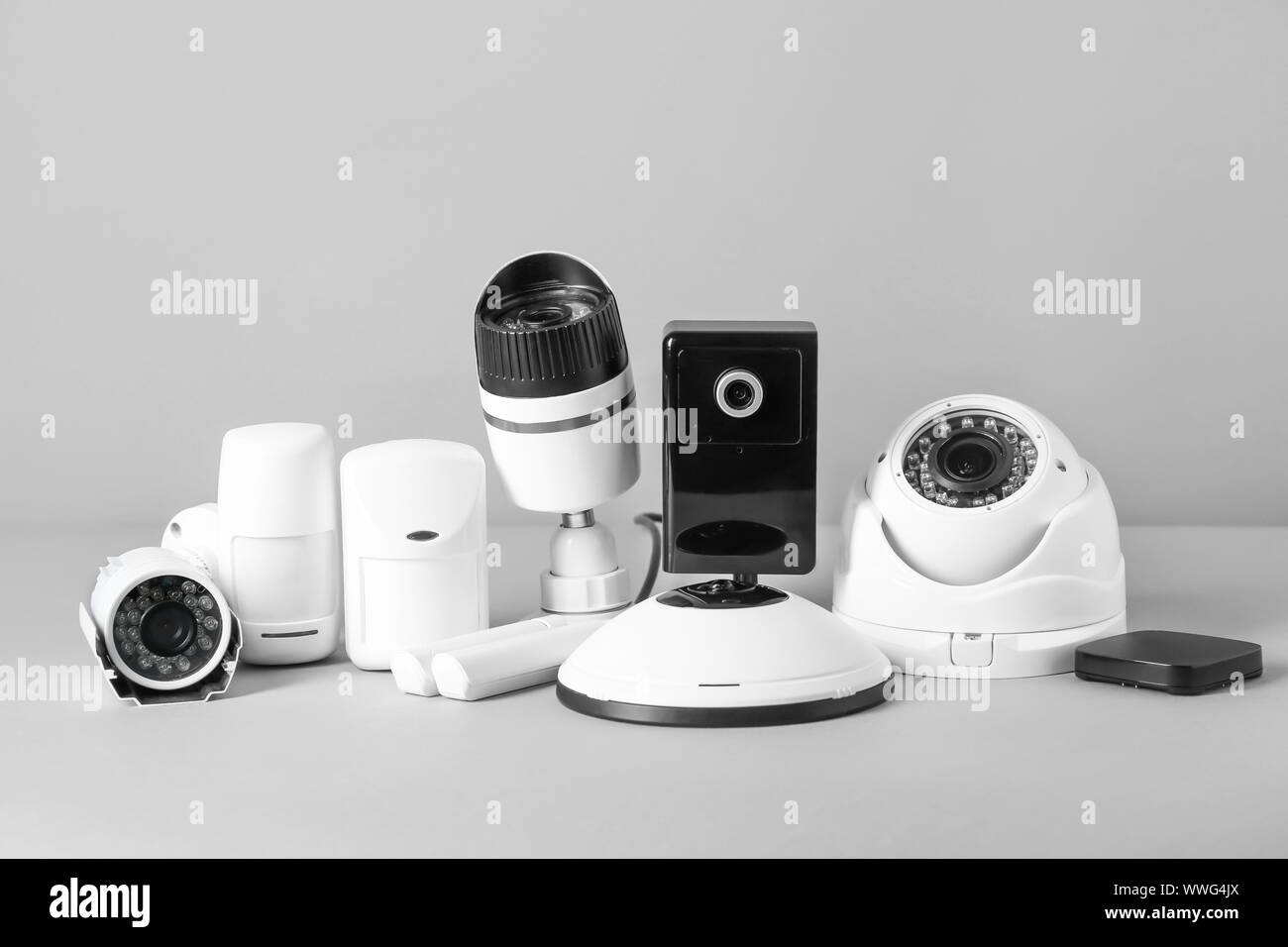 Different equipment of security system on grey background Stock Photo ...