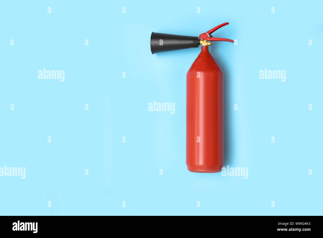 Fire extinguisher on color background Stock Photo - Alamy