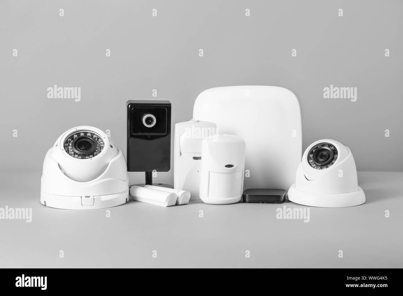 Different equipment of security system on grey background Stock Photo ...