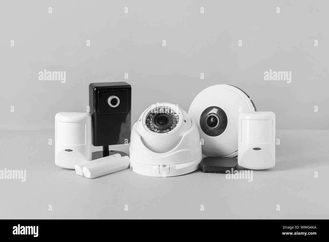 Different equipment of security system on grey background Stock Photo ...