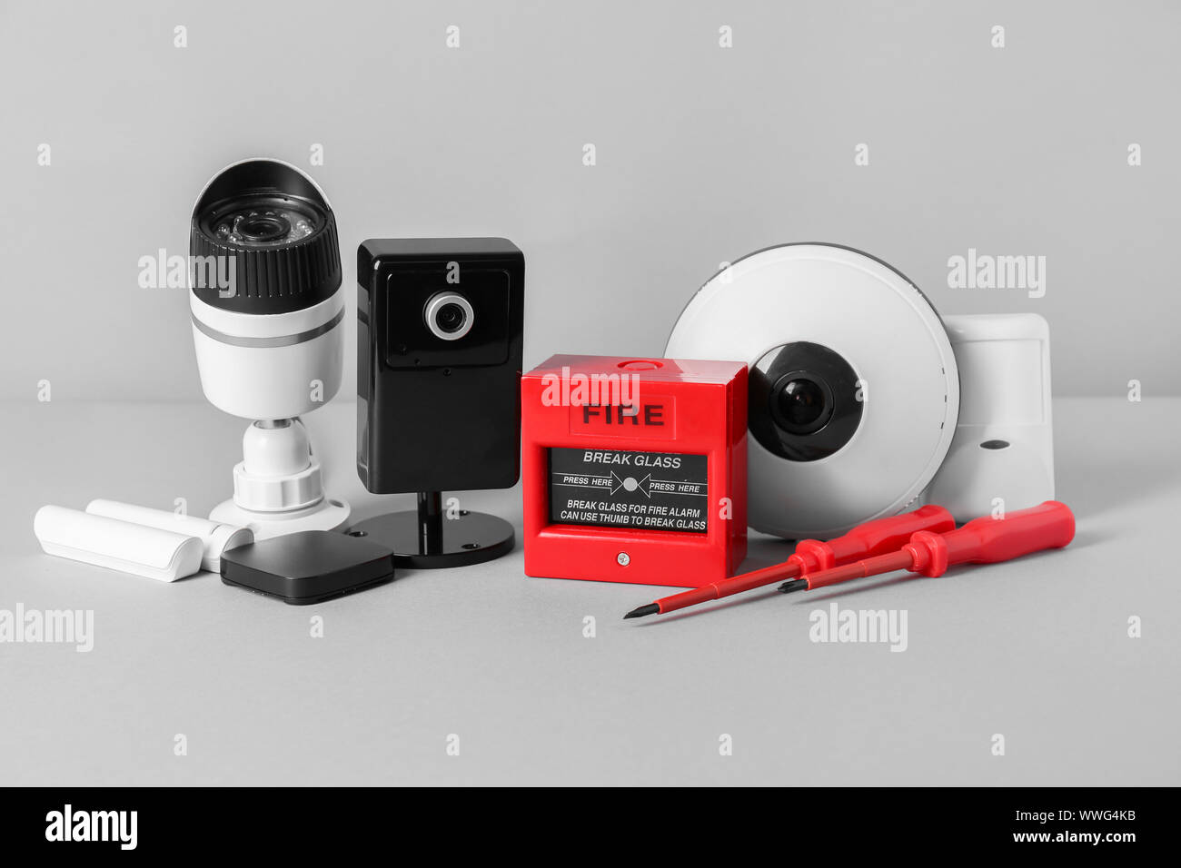 Different equipment of security system on grey background Stock Photo ...