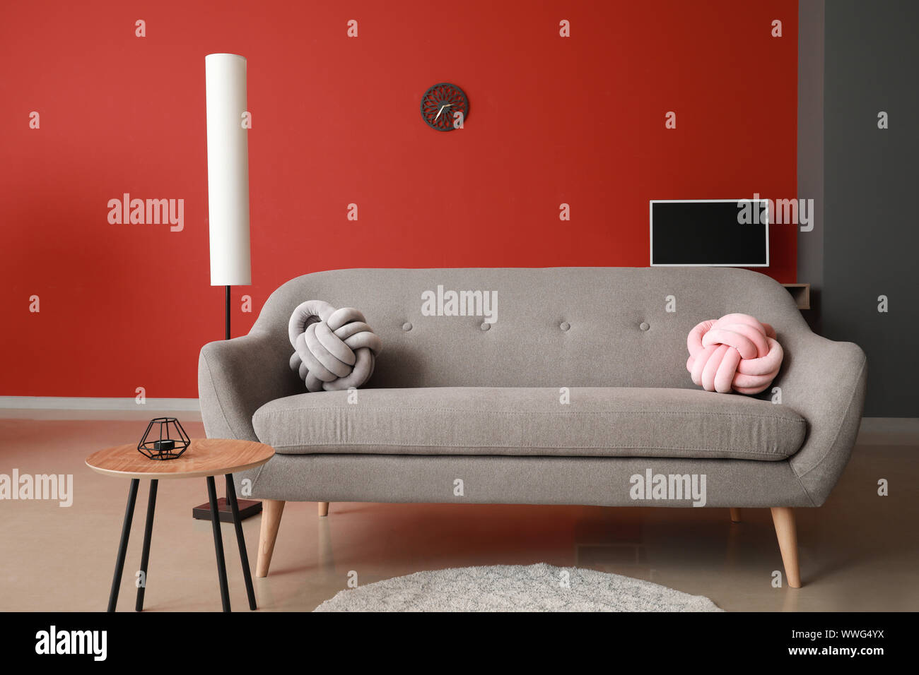 Stylish interior of room with soft couch Stock Photo - Alamy