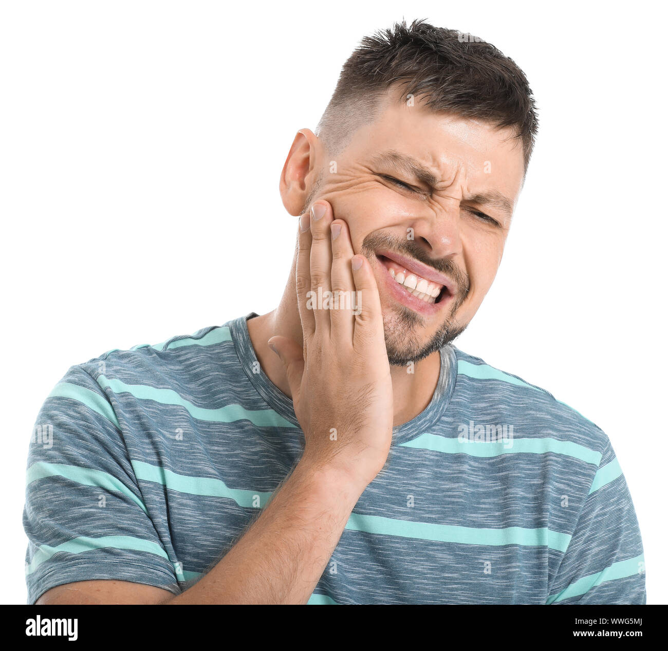 Man suffering from toothache against white background Stock Photo - Alamy