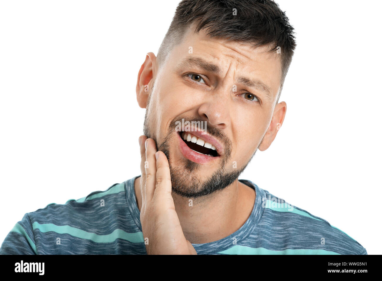 Man suffering from toothache against white background Stock Photo - Alamy