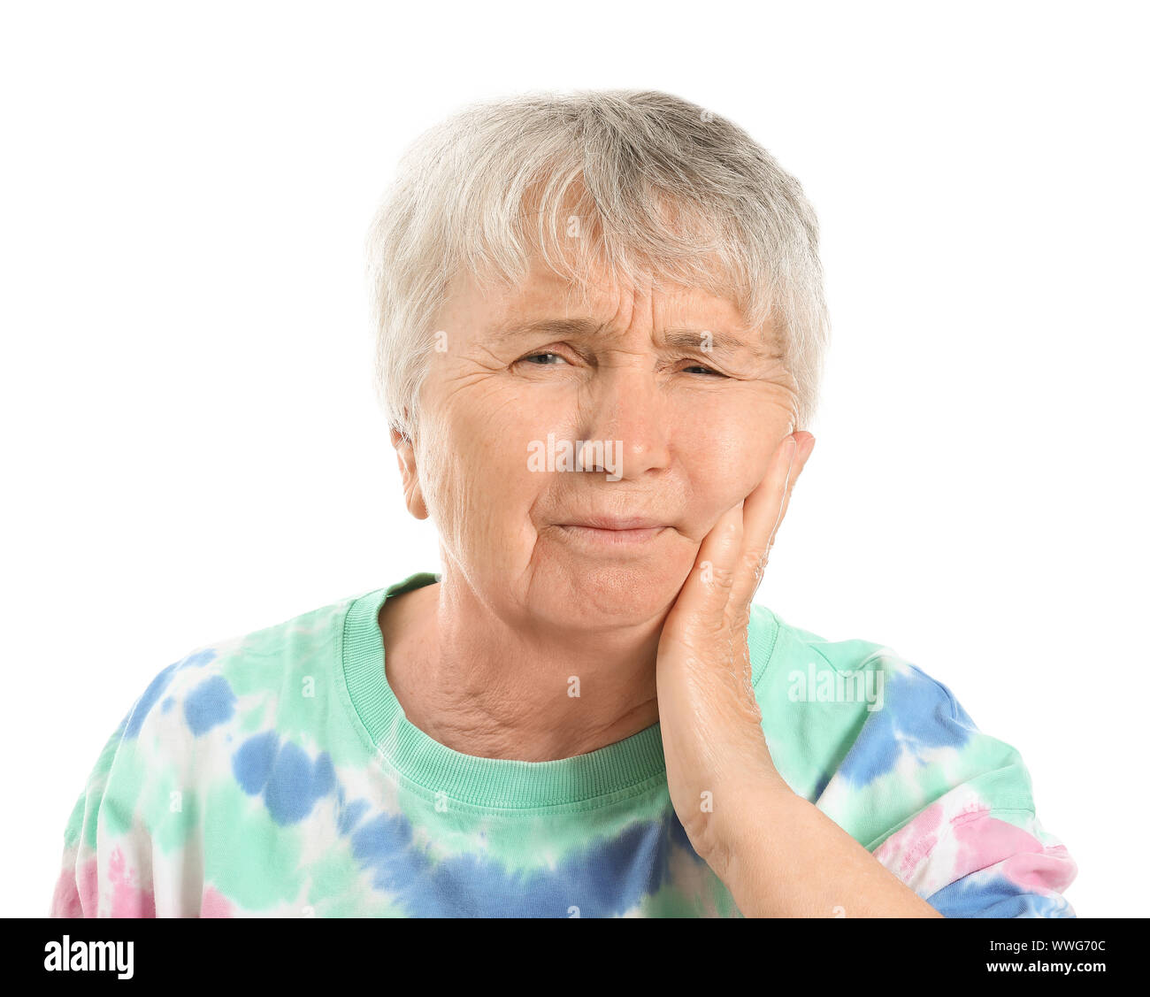 Senior woman suffering from toothache against white background Stock ...