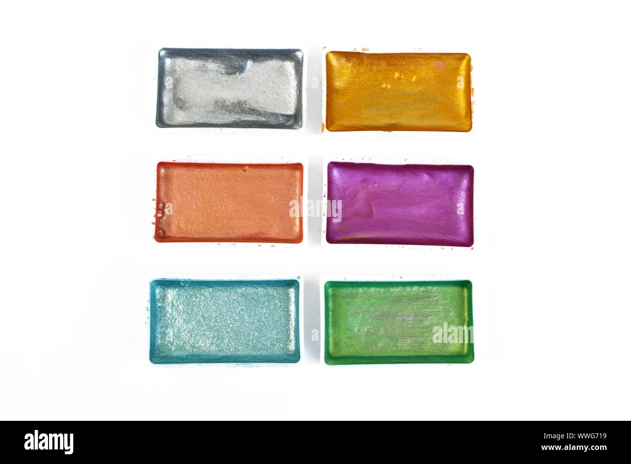 Top view of colorful metallic shimmering single watercolor palettes ...