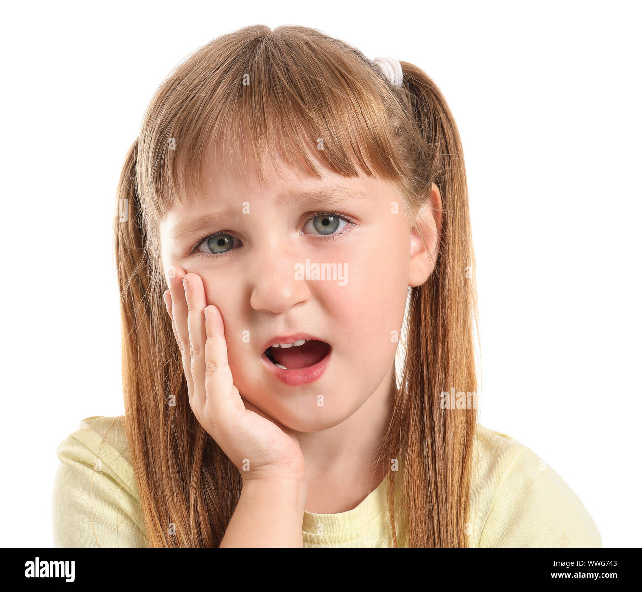 Little girl suffering from toothache on white background Stock Photo ...