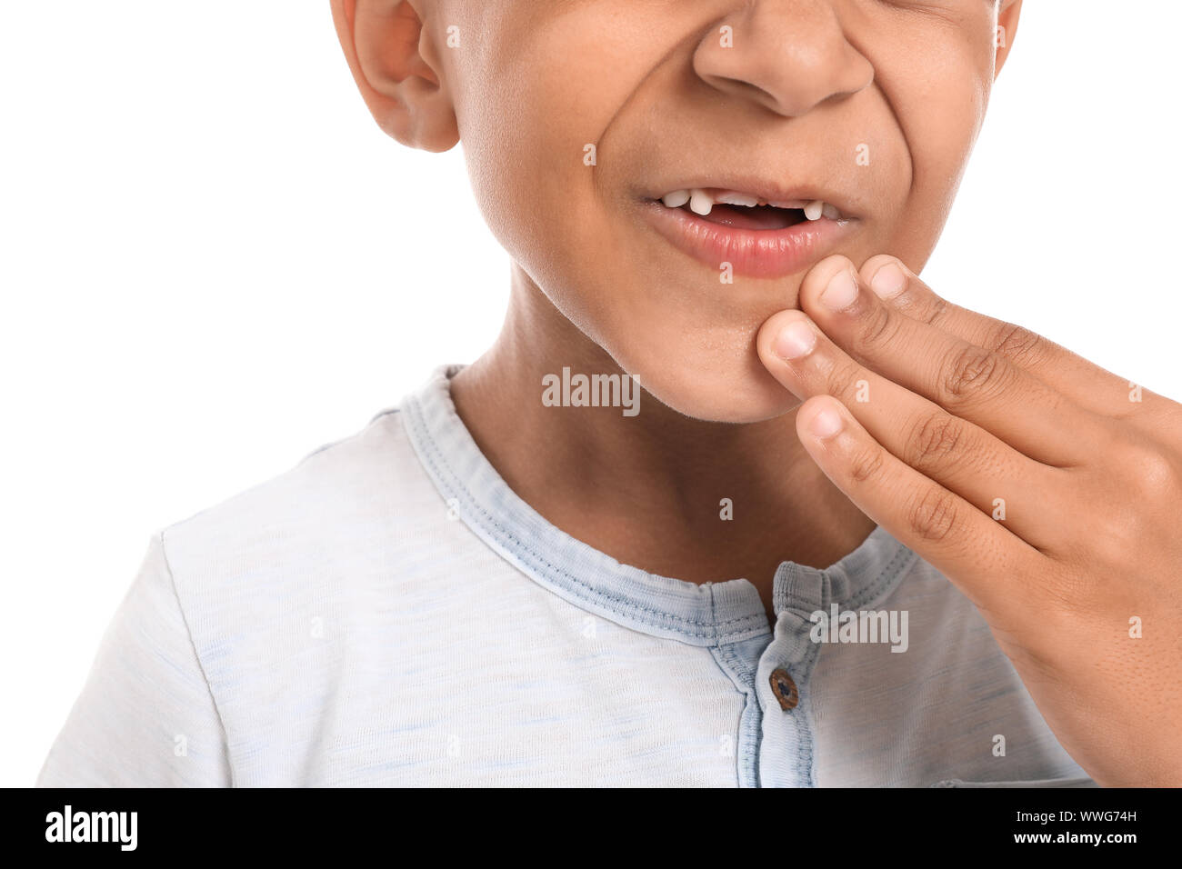 Little African-American boy suffering from toothache against white ...