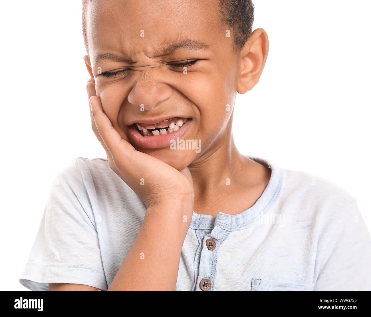 Little African-American boy suffering from toothache against white ...