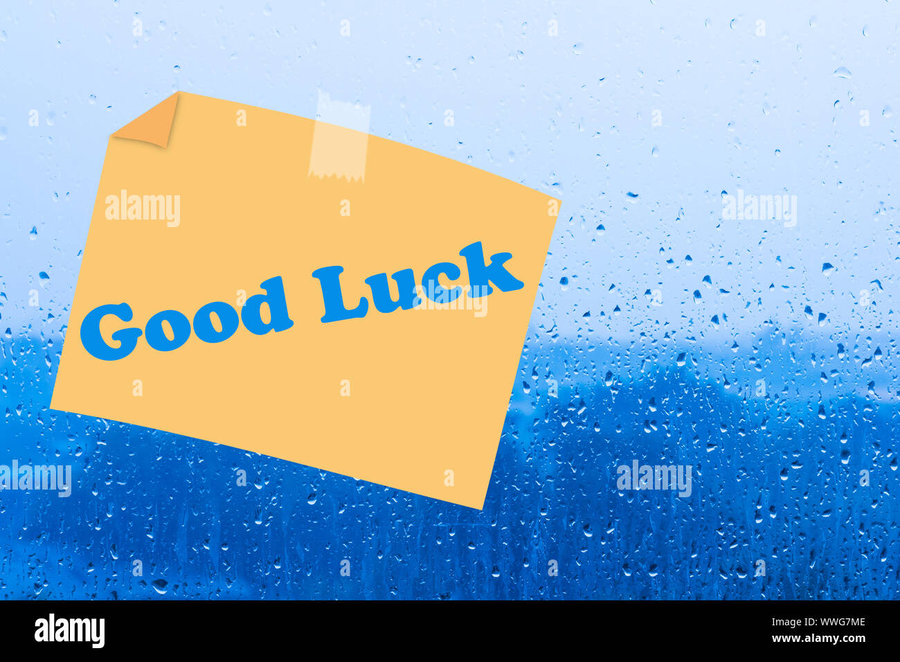 Good luck concept, yellow paper on blur background Stock Photo - Alamy