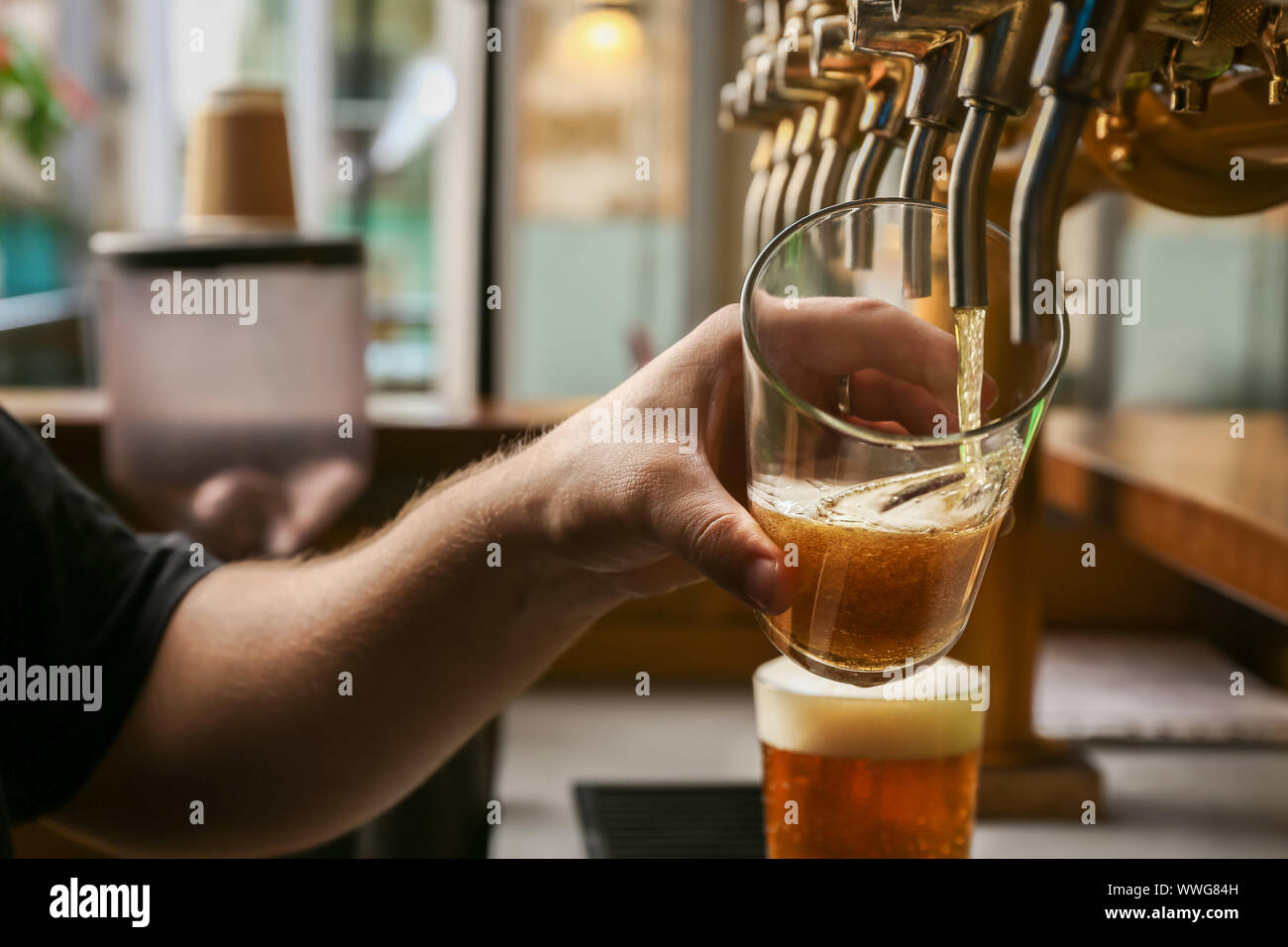 Pouring fresh beer in glass hi-res stock photography and images - Alamy