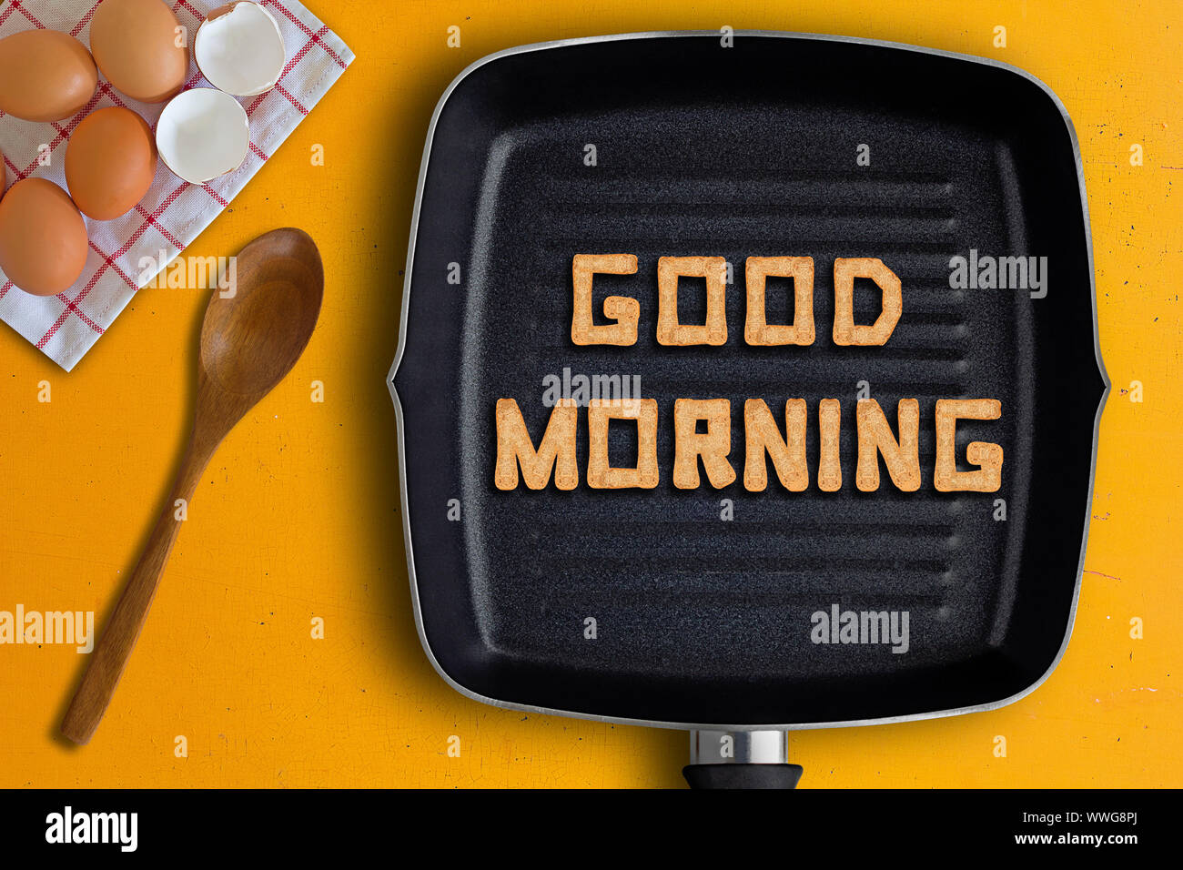 Good morning and wake up concept, bread text and grill pan Stock Photo ...