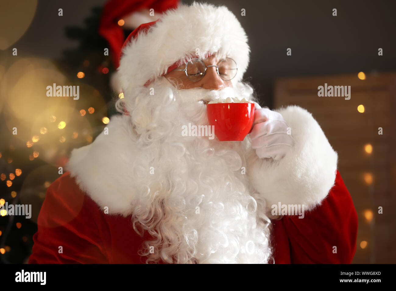 Santa Claus drinking hot chocolate on Christmas eve Stock Photo - Alamy