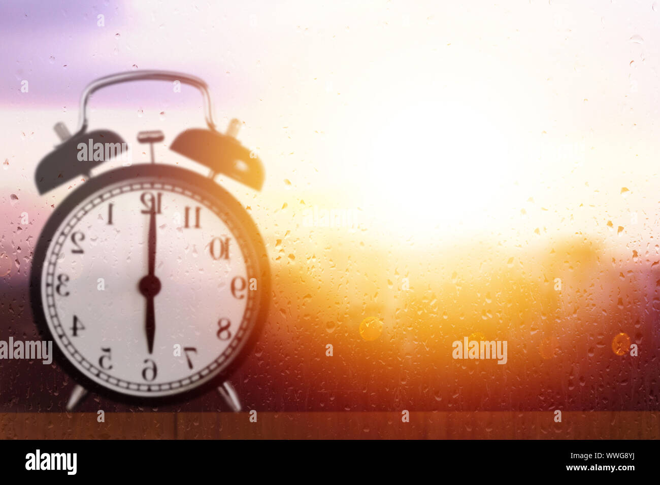 Good morning and wake up concept, alarm clock reflection on glass Stock ...