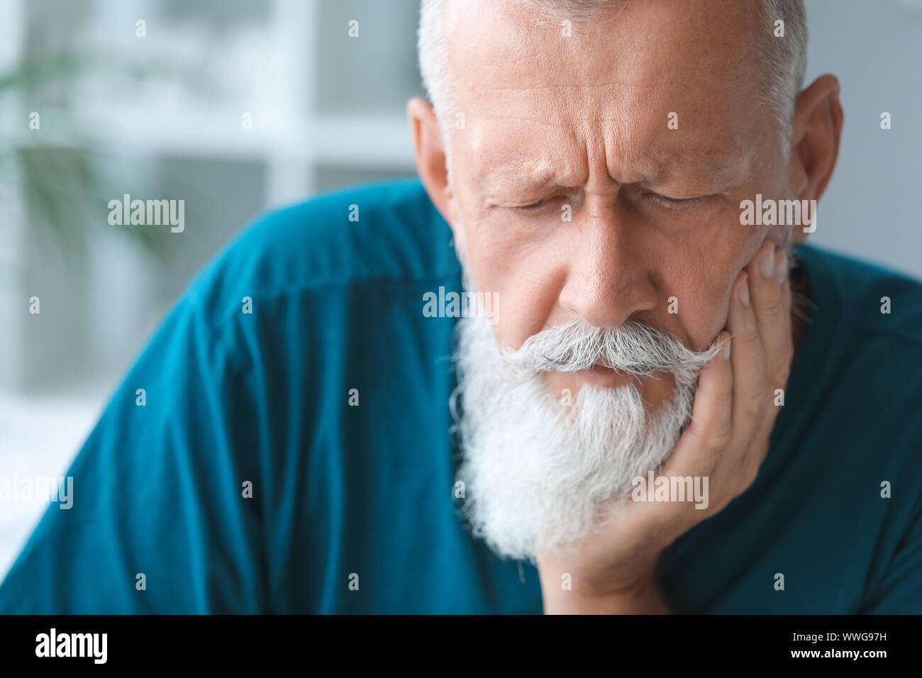 Mature adult man toothache home hi-res stock photography and images - Alamy