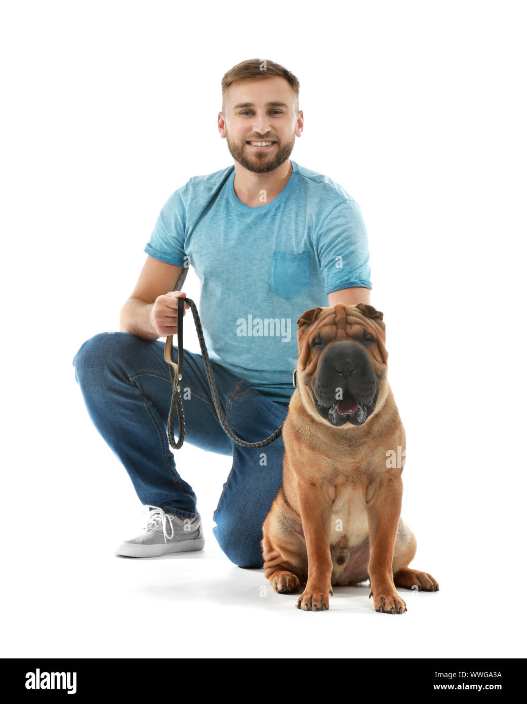 Happy man with cute dog on white background Stock Photo - Alamy