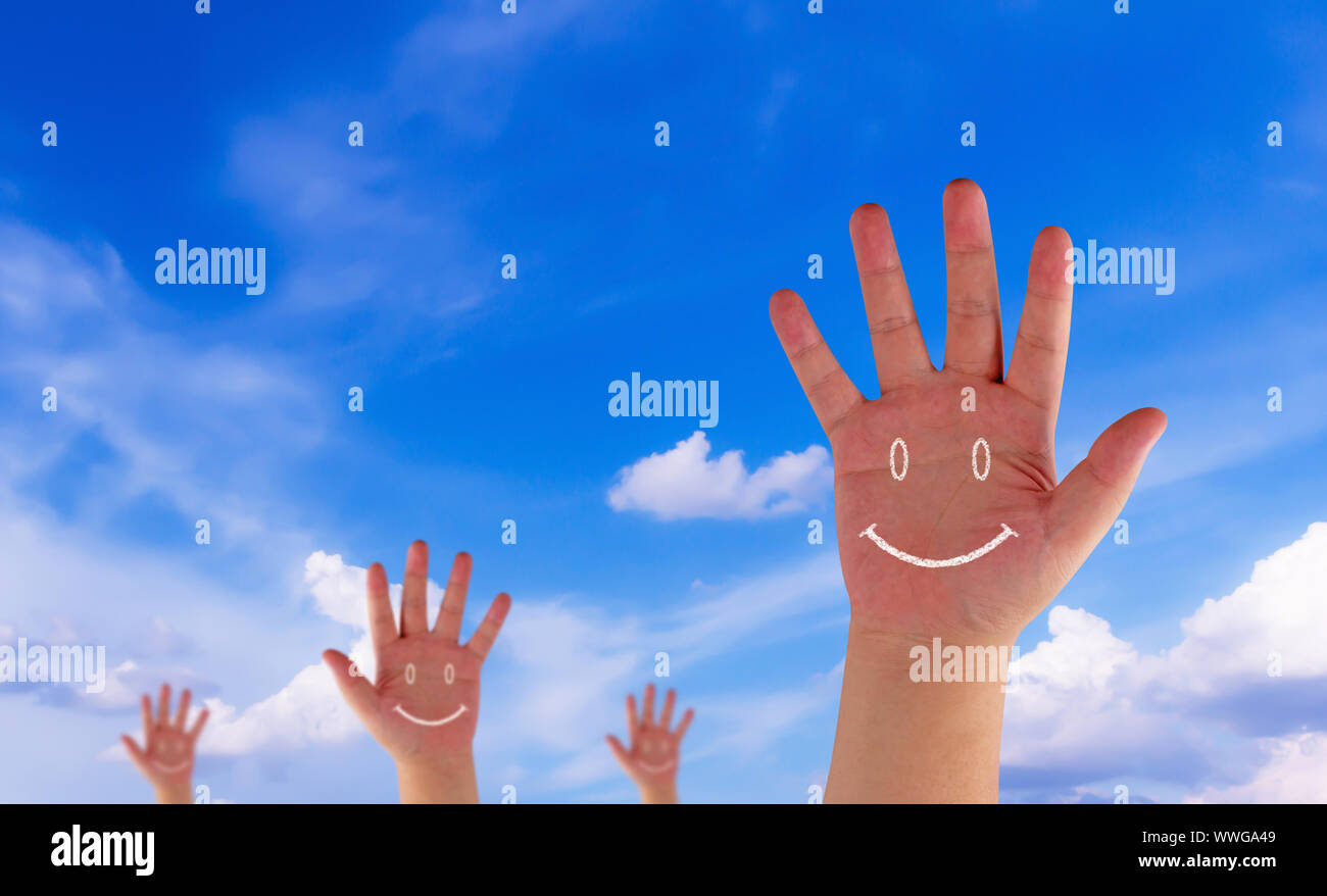 Happiness concept, hand and drawing smile on blue sky background Stock ...