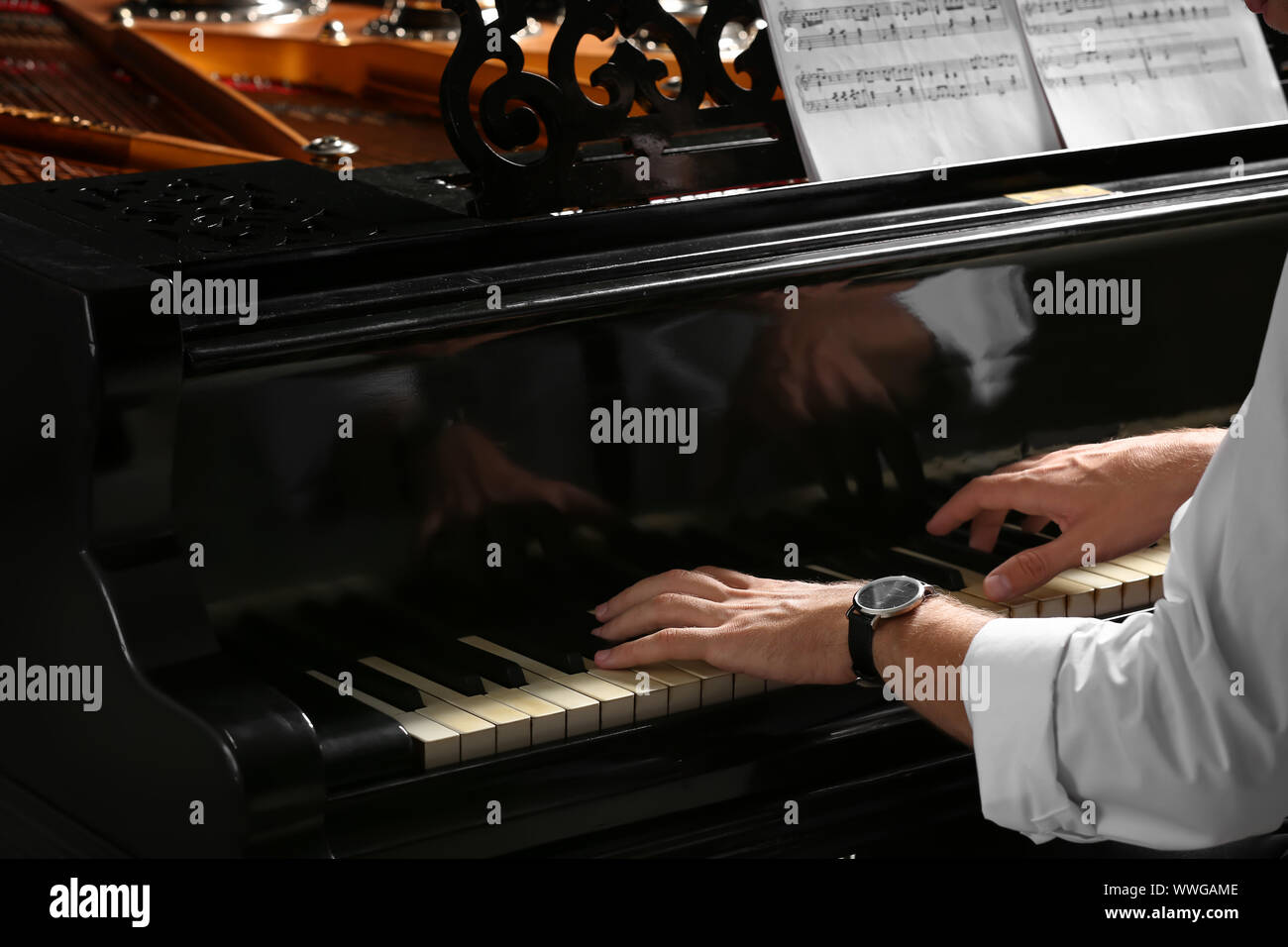 Man playing grand piano at the concert Stock Photo - Alamy
