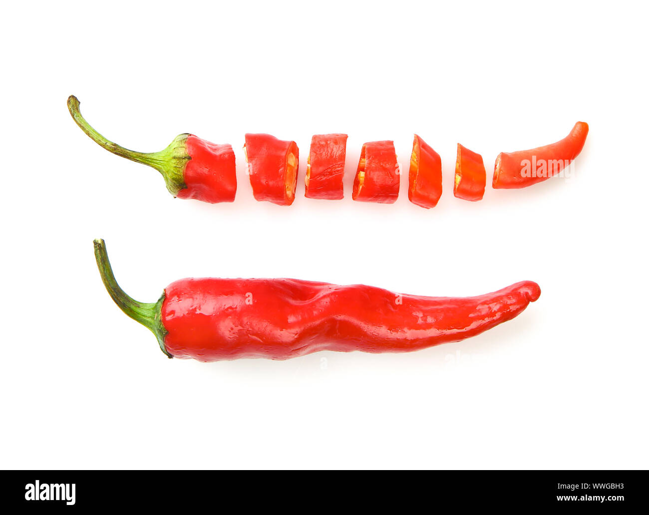 Whole and cut red chili peppers on white background Stock Photo - Alamy