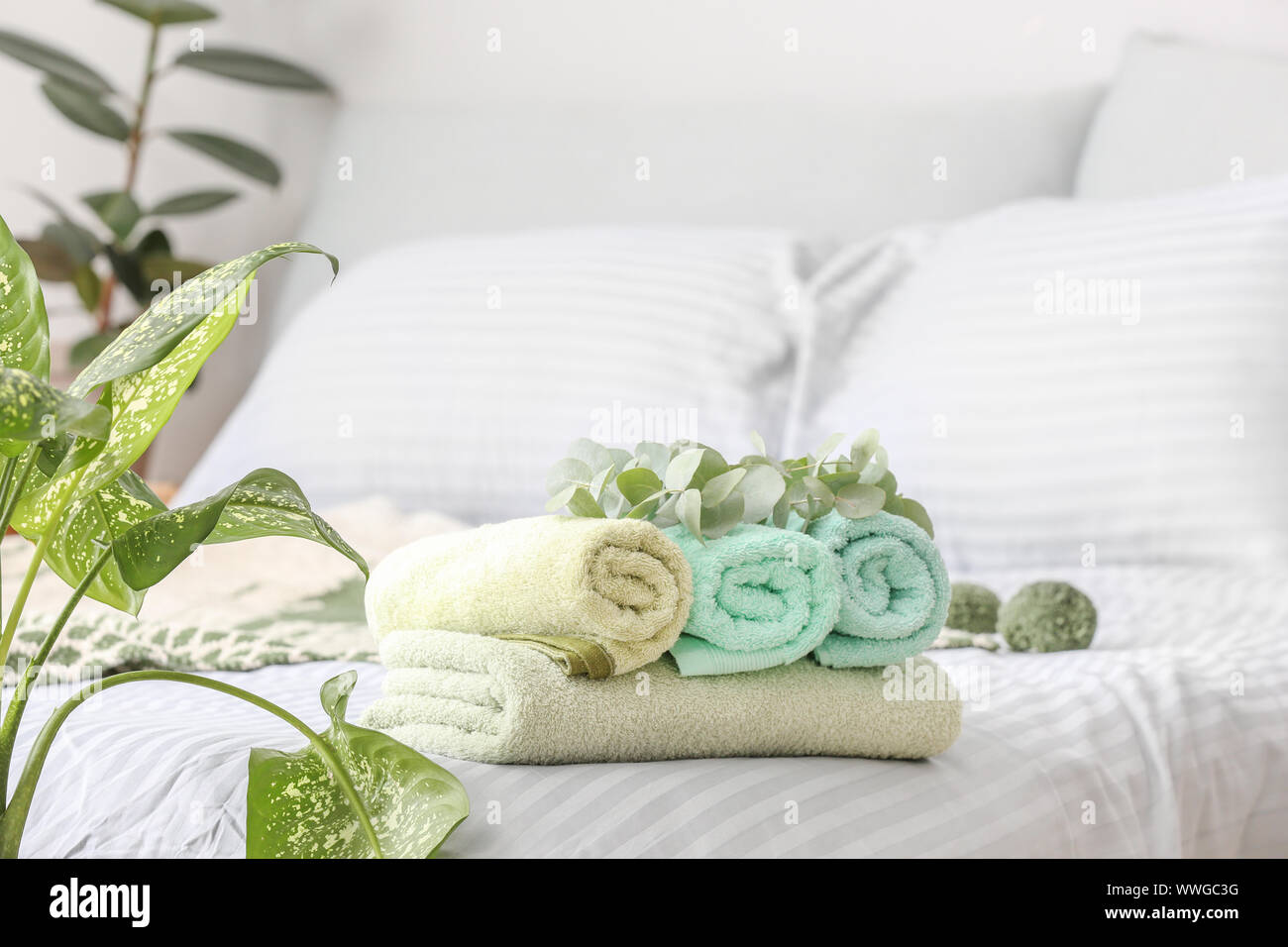 Clean soft towels on bed Stock Photo - Alamy