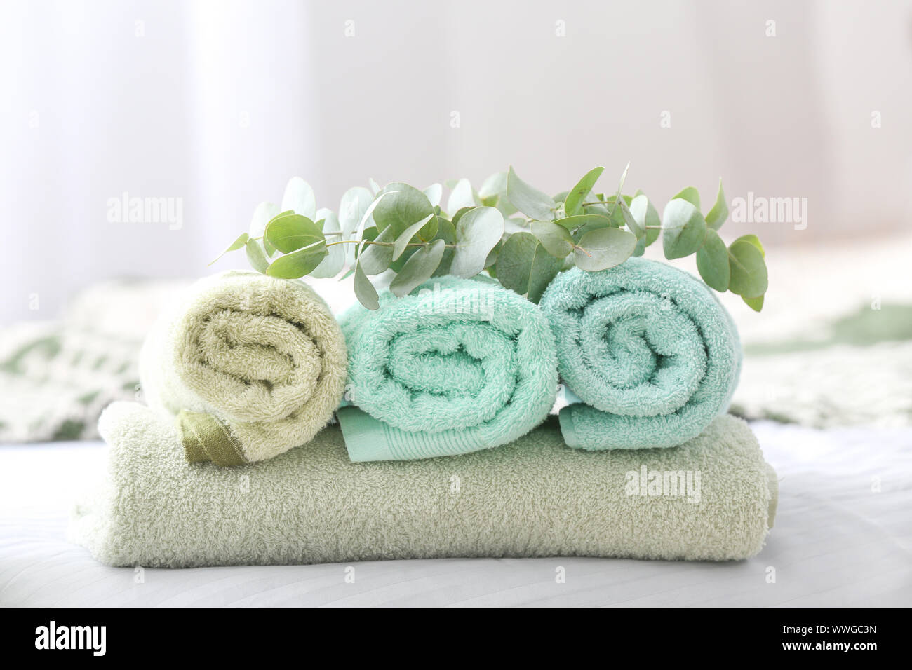Clean soft towels on bed Stock Photo - Alamy
