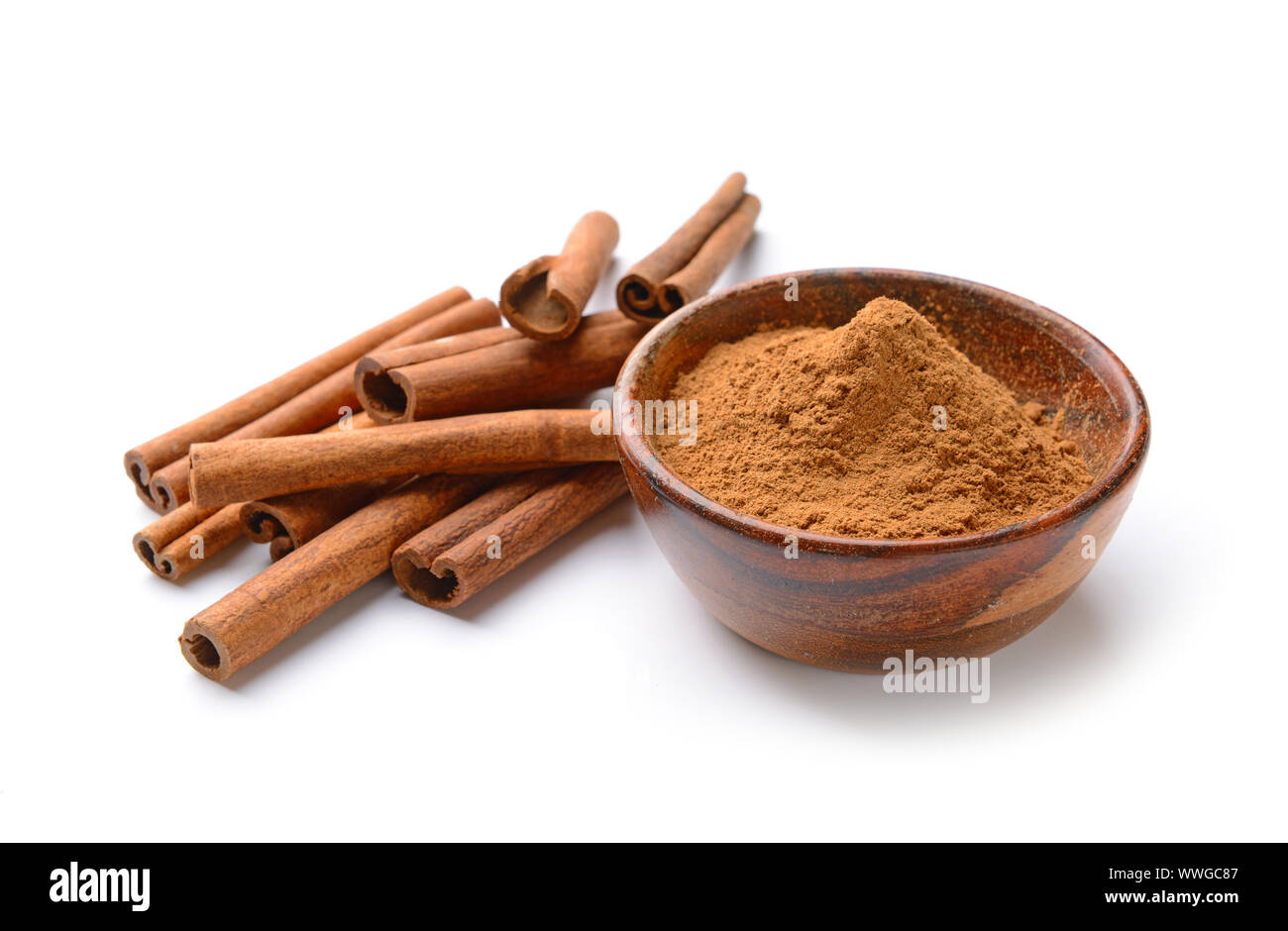 Aromatic cinnamon sticks and powder on white background Stock Photo - Alamy