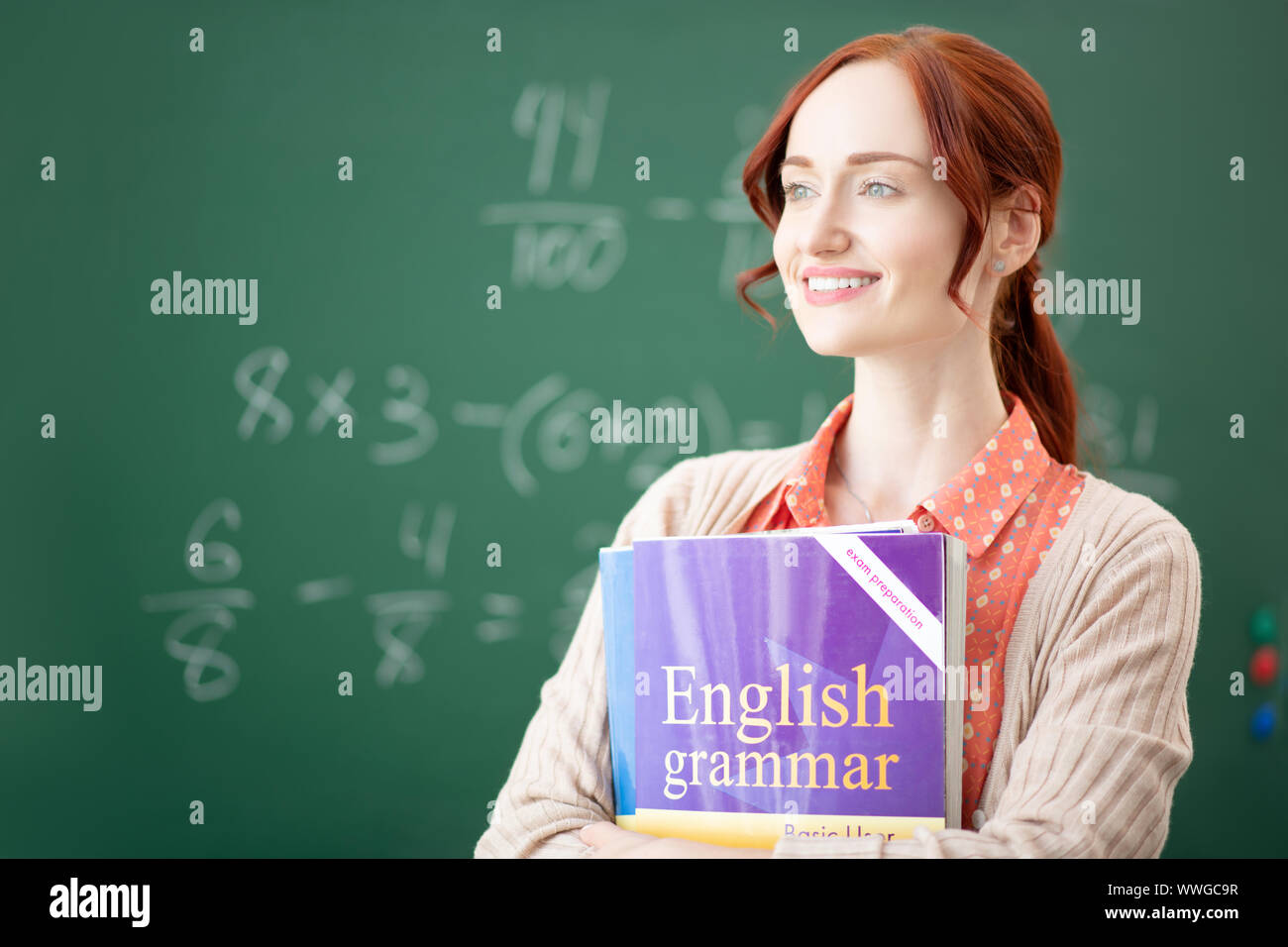 Red-haired English teacher feeling thoughtful before lesson Stock Photo ...