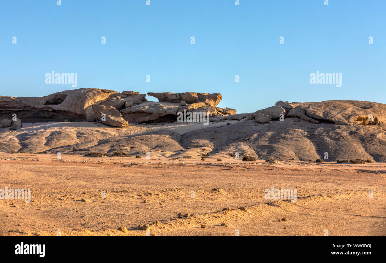 Rock formation Vogelfederberg in Namib desert, sunset scene, landscape ...