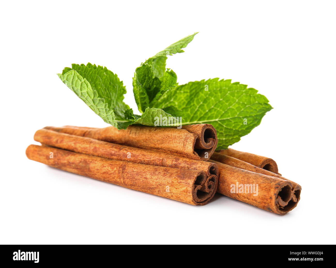 Fresh mint with cinnamon on white background Stock Photo - Alamy