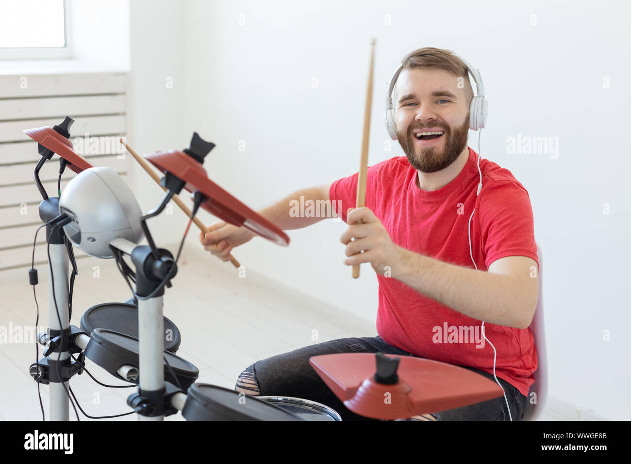 People, music and hobby concept - Man in his spare time playing the ...
