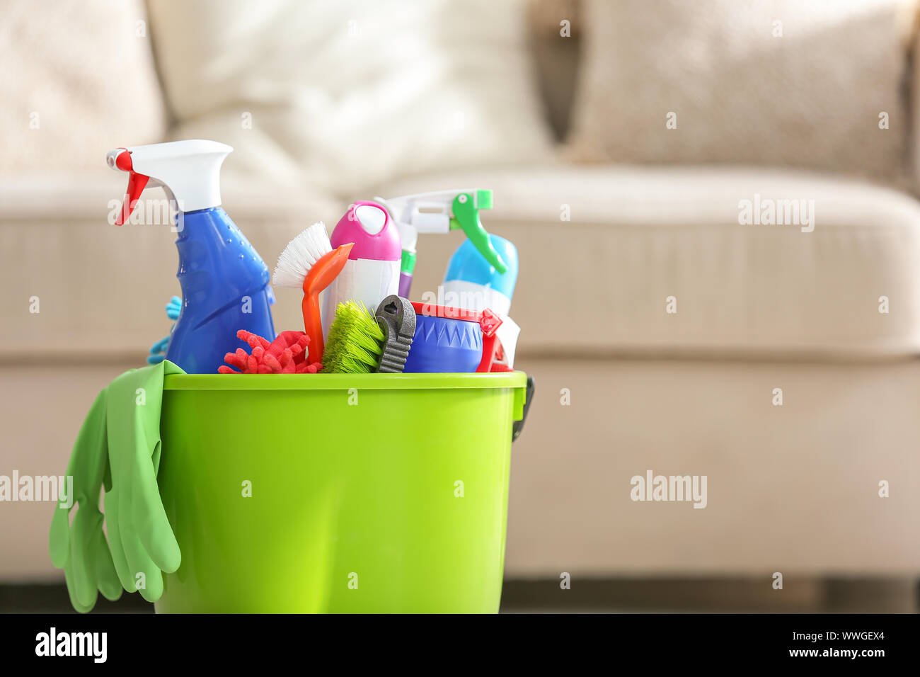 Bucket with cleaning supplies in room Stock Photo - Alamy