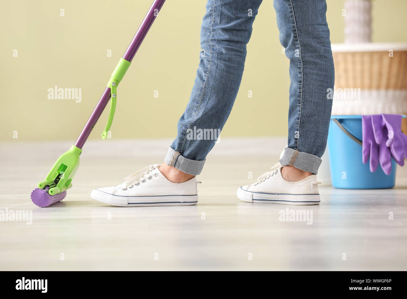 Woman cleaning floor in room Stock Photo - Alamy