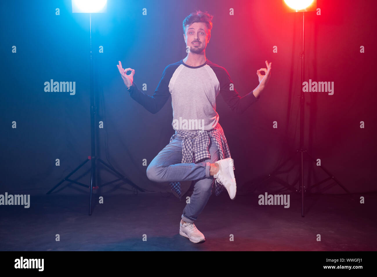 Dance, hip-hop and reggaeton concept - young man dancing over the ...