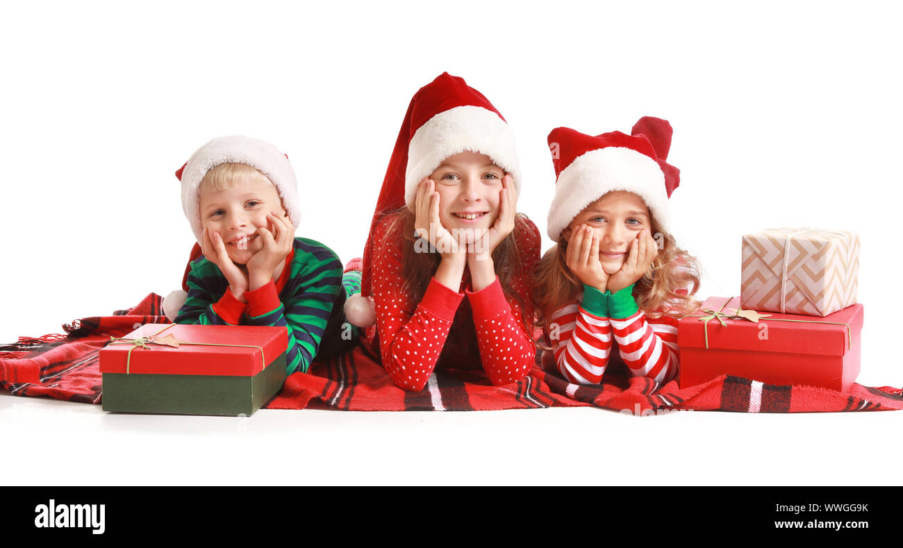 Cute little children with Christmas gifts on white background Stock ...