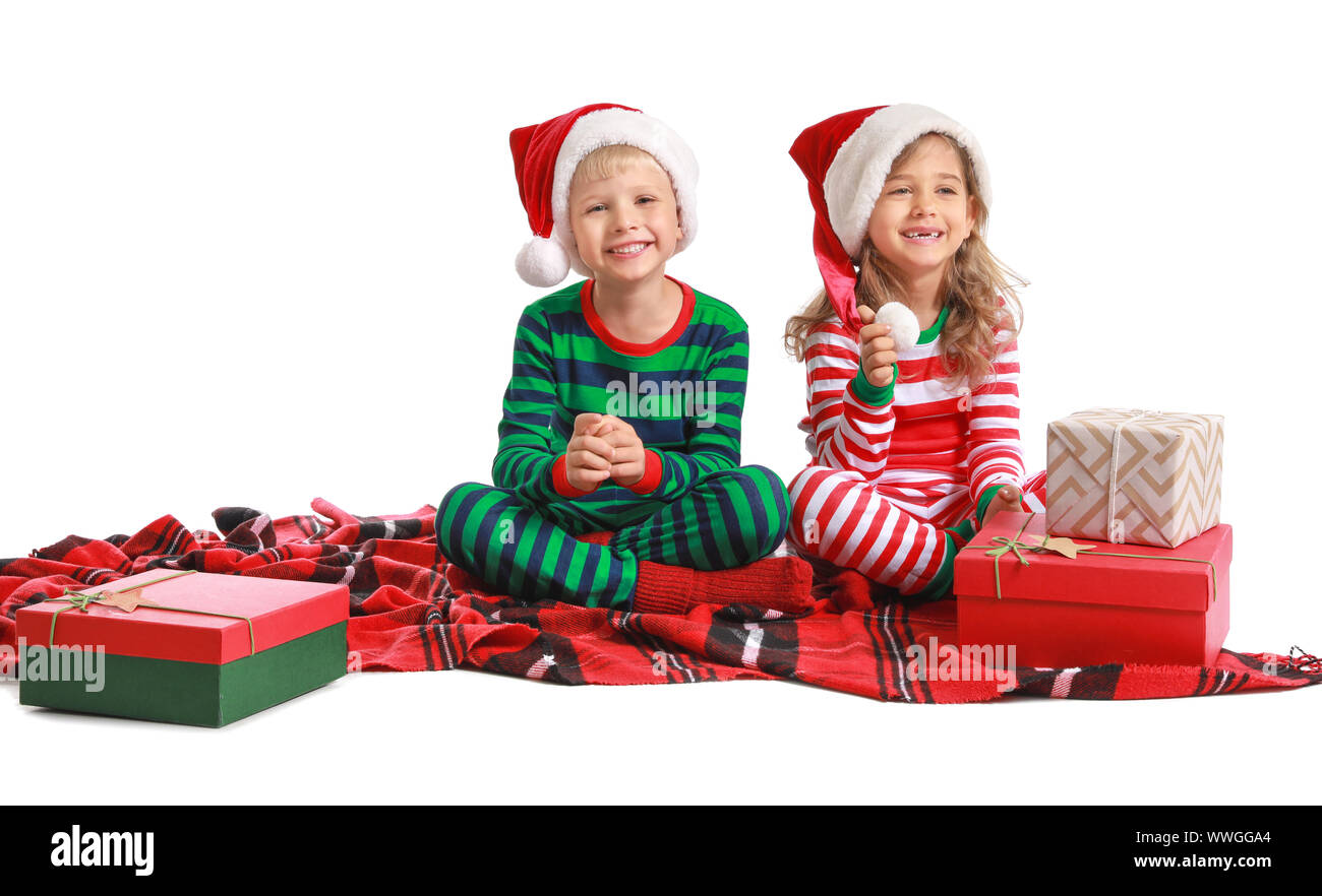 Cute little children with Christmas gifts on white background Stock ...