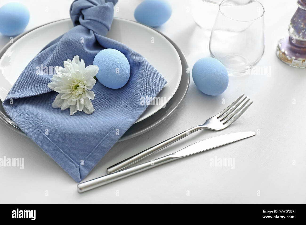 Table setting for Easter celebration on white background Stock Photo ...