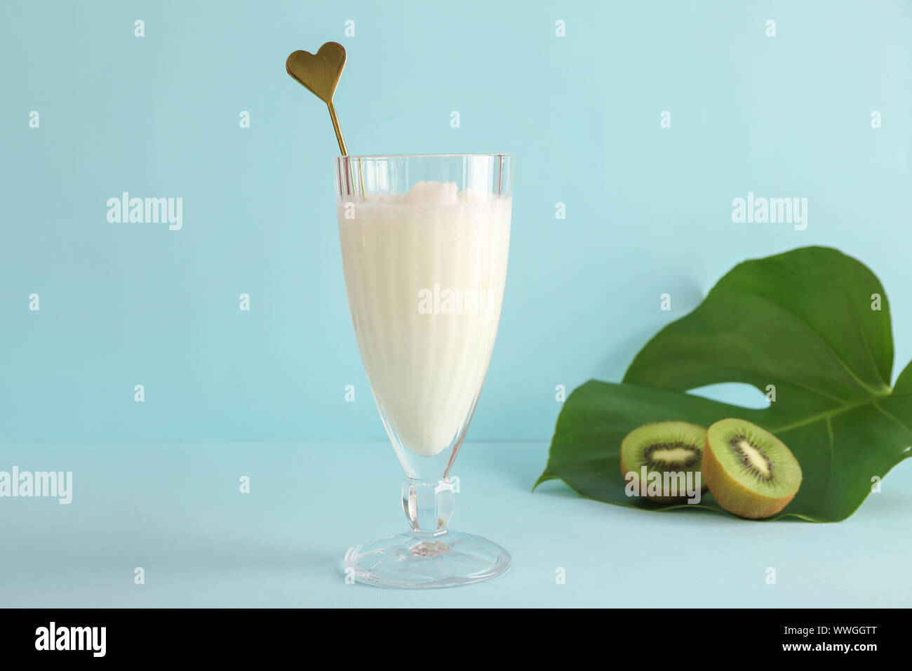 Glass of tasty Pina Colada cocktail on color background Stock Photo - Alamy