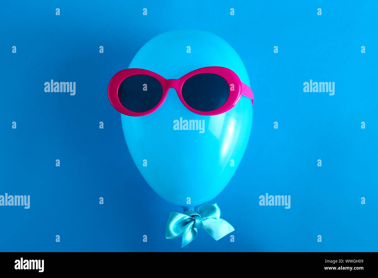 Stylish sunglasses with air balloon on color background Stock Photo - Alamy